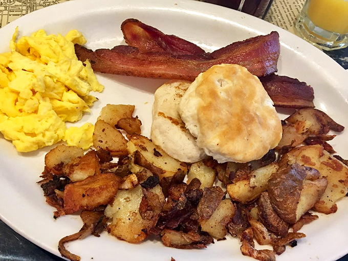 The classic breakfast platter &ndash; where eggs, bacon, homefries and biscuit gather like old friends for their daily meeting on the perfect white plate.