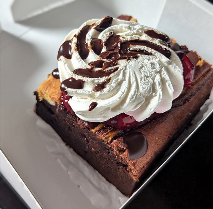 This brownie isn't just dessert&mdash;it's architecture with whipped cream, chocolate drizzle, and absolutely zero regrets.