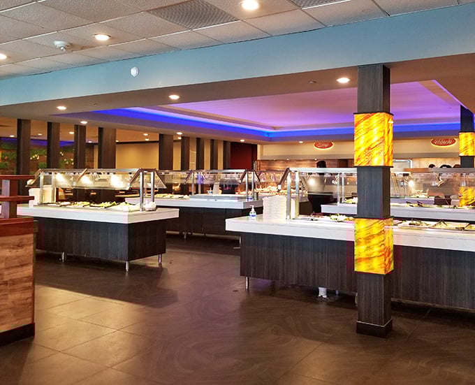 The buffet stations gleam under blue accent lighting like a culinary spaceship ready to transport you to flavor dimensions unknown to your neighborhood diner.