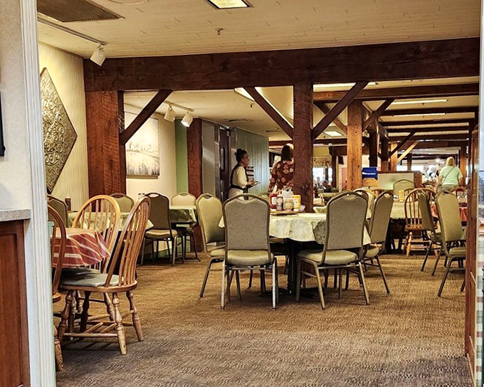 Exposed wooden beams frame dining spaces that feel both spacious and intimate&mdash;like eating in your dream country home's dining room.