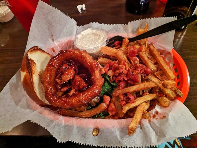 The glossy pretzel bun cradles a perfectly cooked patty and fresh greens &ndash; proof that beauty in food requires no filter.