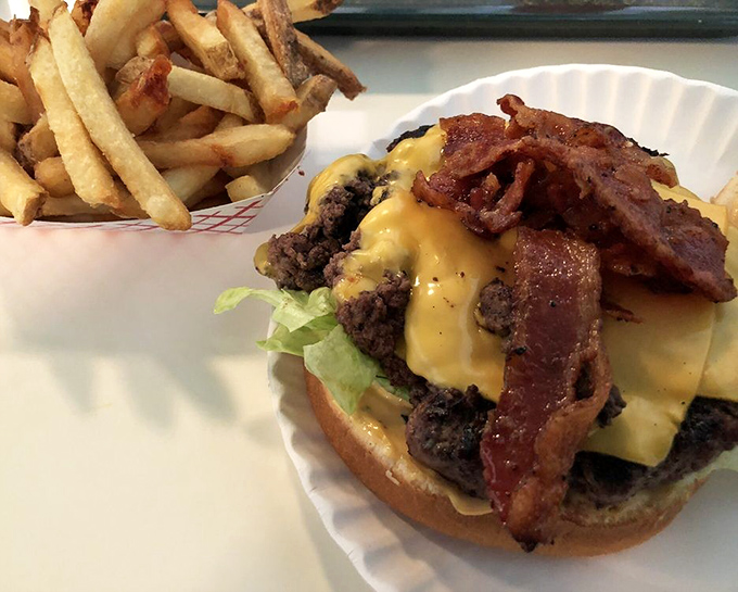 This isn't just a bacon cheeseburger&mdash;it's proof that sometimes the simplest pleasures in life are stacked three inches high and require both hands.