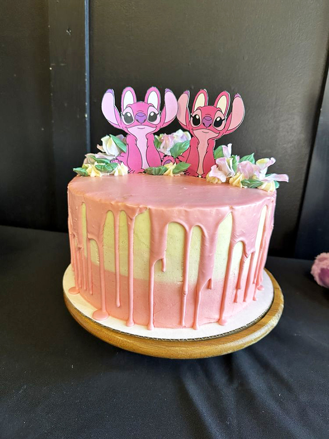 Even Stitch would approve of this whimsical pink drip cake that transforms a simple celebration into a moment of pure, childlike joy.