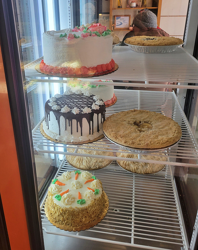 A cake display that's basically an adult version of a toy store window. Each creation promises a celebration, whether you have something to celebrate or not.