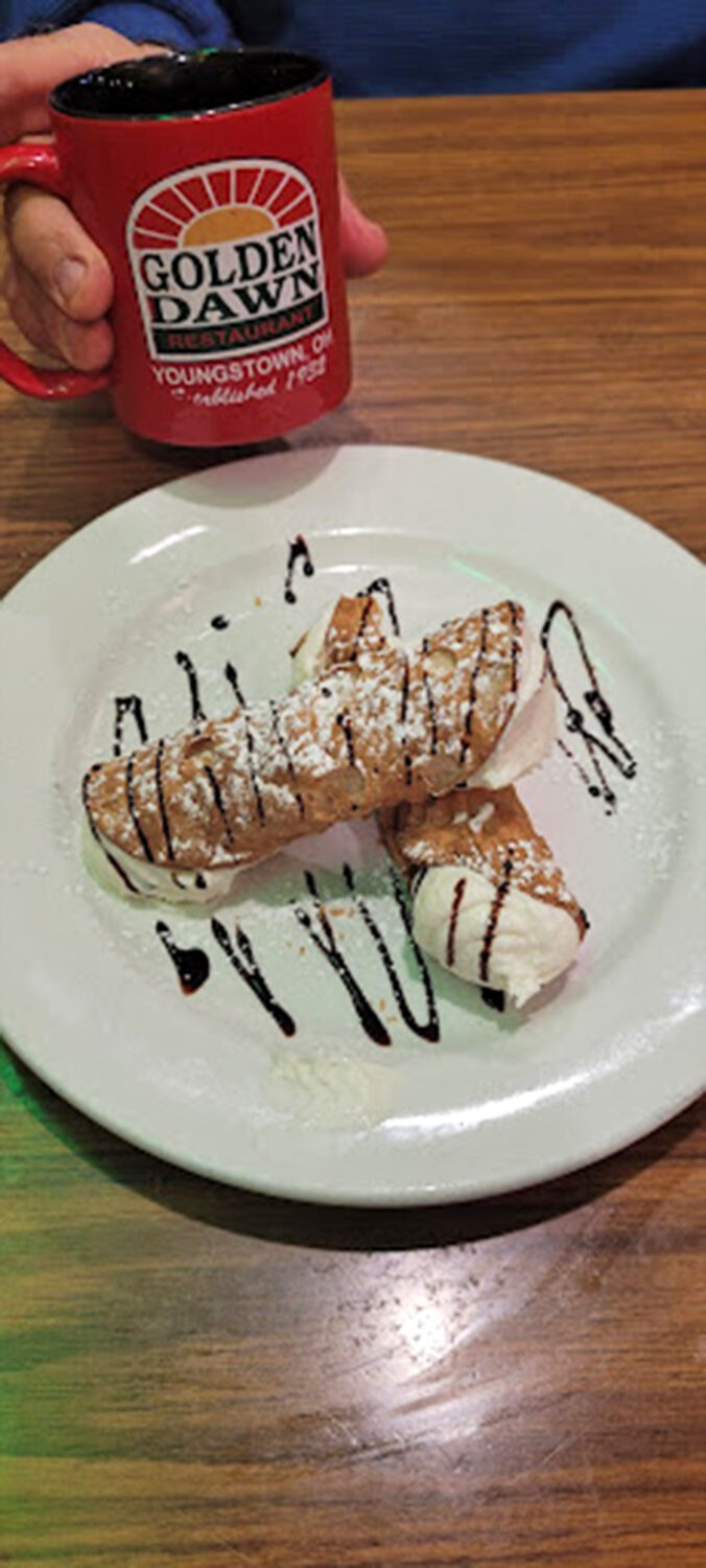 Cannolis that would make your Italian grandmother weep with joy, served with the restaurant's signature coffee in their custom mug.