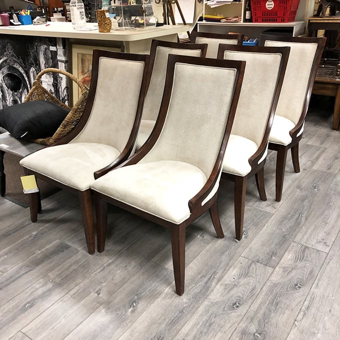 These elegant dining chairs with their cream upholstery and dark wood frames are waiting for their next dinner party. Sophisticated without trying too hard&mdash;like Audrey Hepburn in chair form.