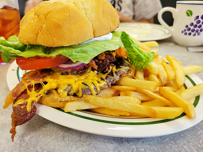 A burger that requires both hands and a strategy. The melted cheese cascading down the sides is pure food poetry.