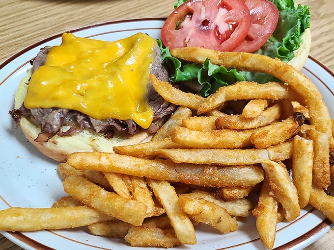 Behold: the cheeseburger in its natural habitat. That melted cheese blanket isn't just topping&mdash;it's tucking the patty in for a flavor nap.