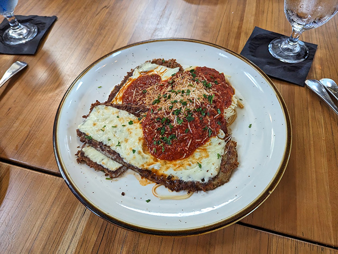 Chicken Parmesan that could make an Italian grandmother nod in approval, with cheese pulling overtime duty.