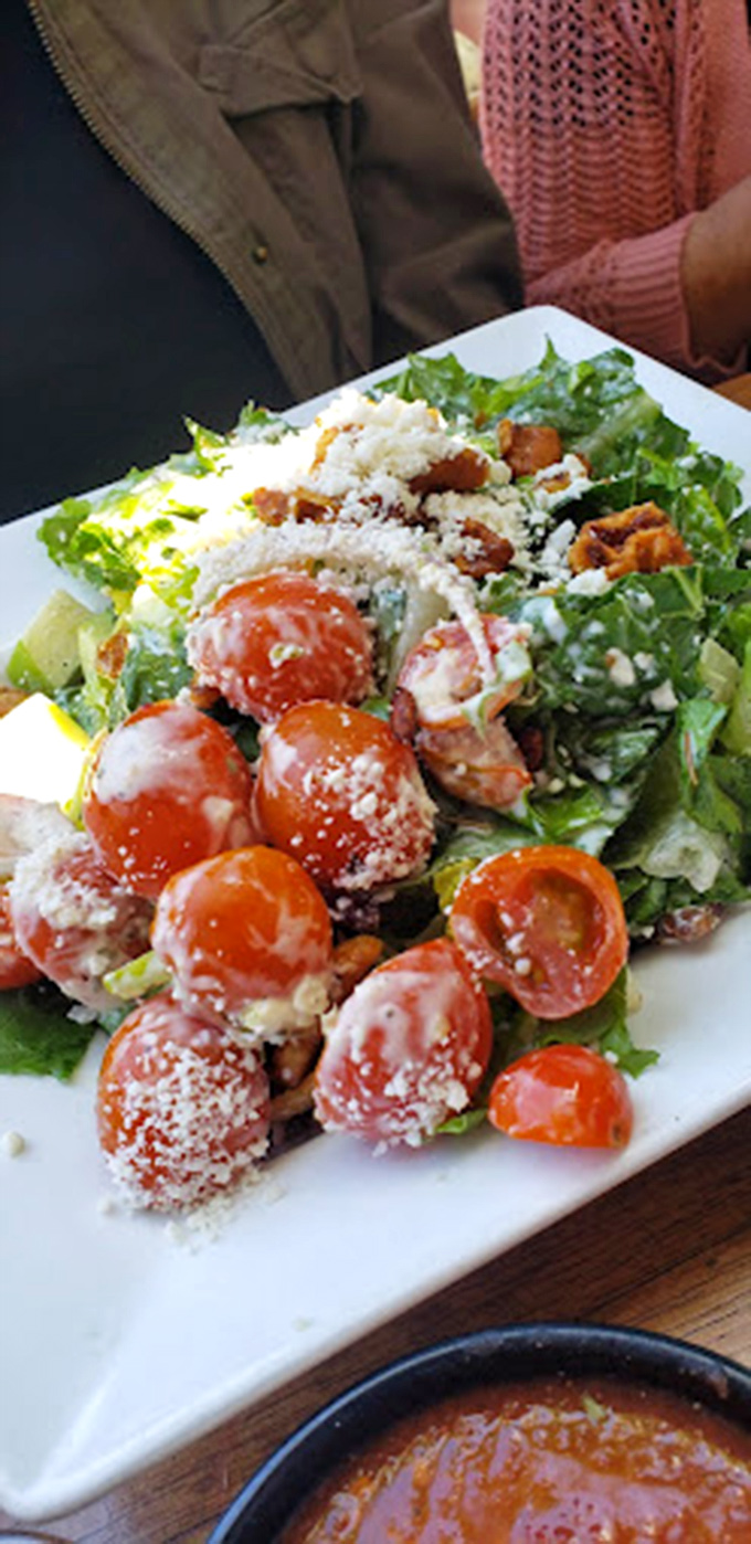 A salad that doesn't apologize for being healthy. Those cherry tomatoes are having more fun than most people on vacation.
