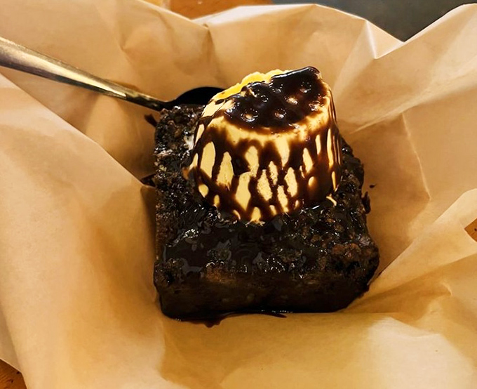 Not just dessert, but a chocolate revelation with what appears to be ice cream slowly surrendering to its warm embrace. Resistance is futile.