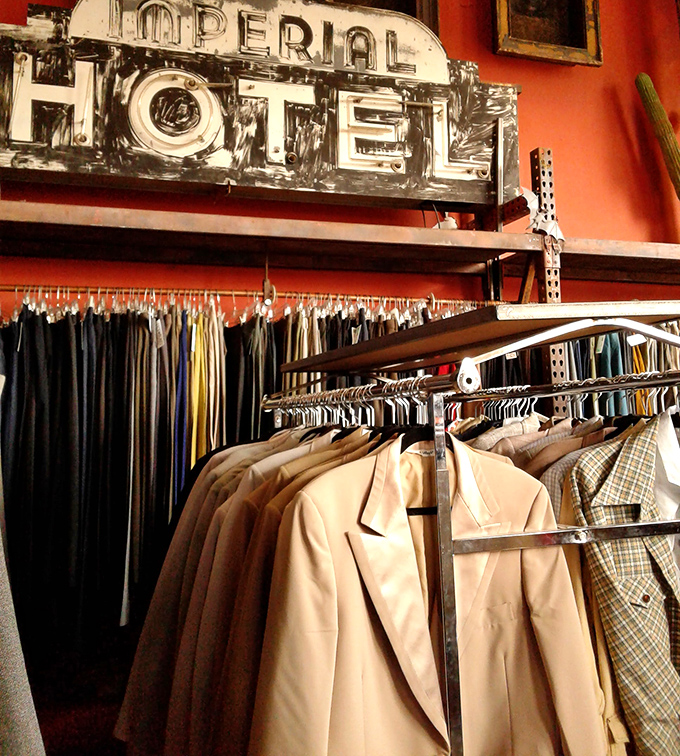 Racks upon racks create clothing canyons where vintage gems hide among everyday finds.