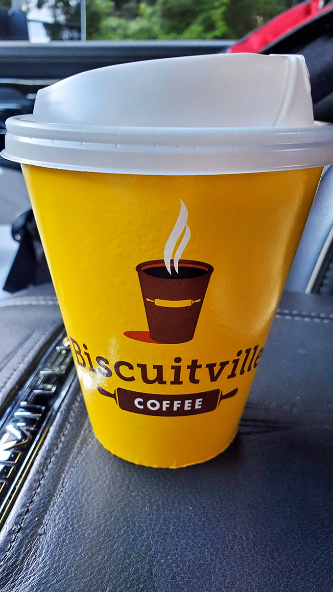 The signature yellow coffee cup brightens car cupholders across North Carolina, fueling morning commutes with liquid motivation.