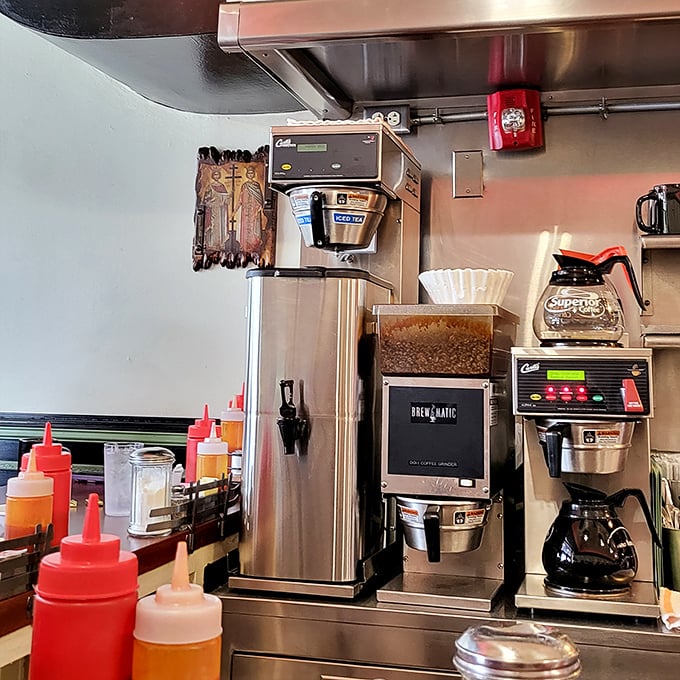 The coffee command center, where morning miracles begin. These machines have probably witnessed more Monday morning resurrections than a revival tent.