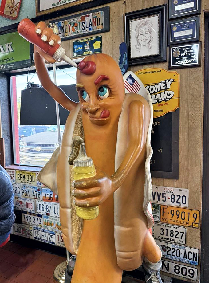 The hot dog statue isn't just kitsch&mdash;it's a guardian of flavor, a sentinel of sausage. Squirting condiments with the confidence we all wish we had. 
