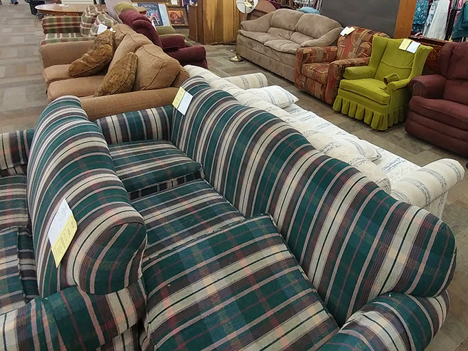 The furniture section showcases seating from every decade. That plaid couch has witnessed more family TV nights than we'll ever know.