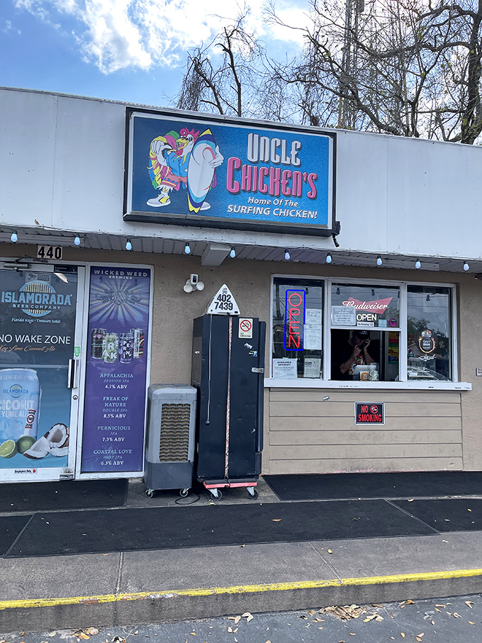 The sign proclaims "Home of the Surfing Chicken," which might be the most Florida phrase I've ever encountered outside of "alligator in the swimming pool." 