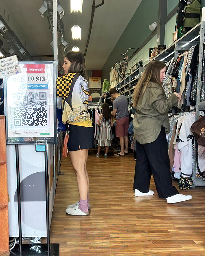 Shoppers browse with purpose, each on their own treasure hunt through racks that refresh faster than your social media feed.