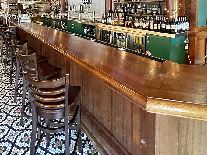 The bar at Oak isn't just where drinks are served; it's where neighborhood legends are born and "I'll just have one" becomes a three-hour conversation.