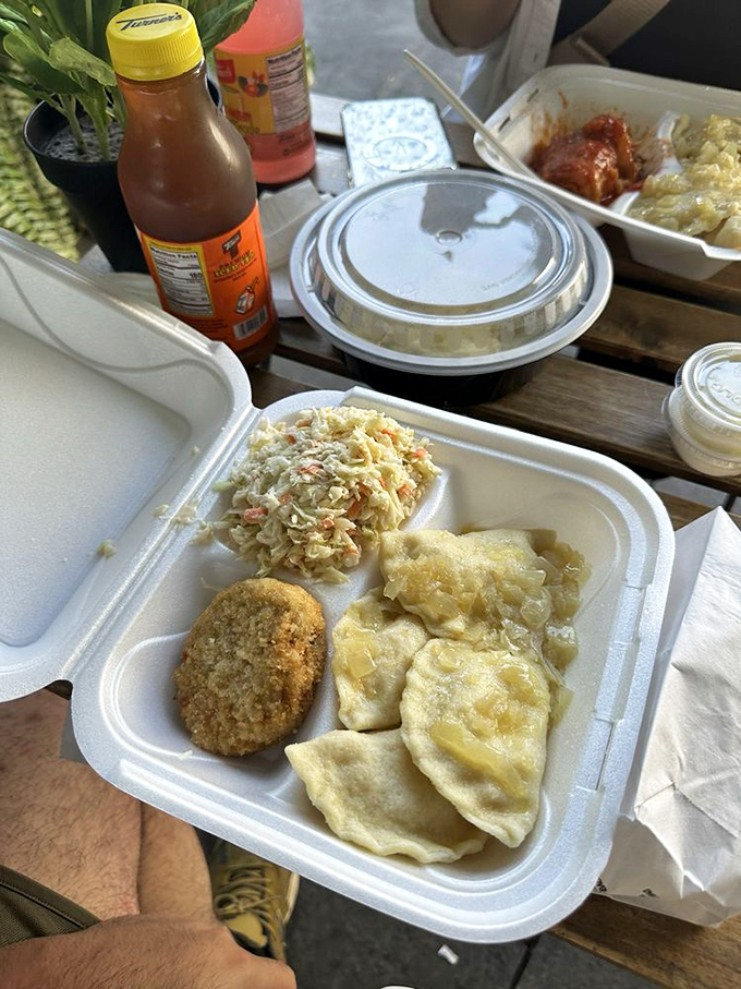A perfect marriage of land and sea: golden-fried crab cake alongside pierogies and haluski. Polish-Maryland fusion at its finest!
