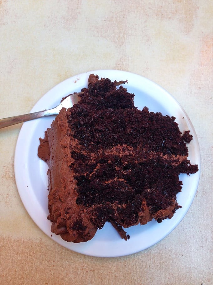 Chocolate cake so rich and decadent it should come with its own tax bracket—the kind of dessert that makes you close your eyes with each forkful.