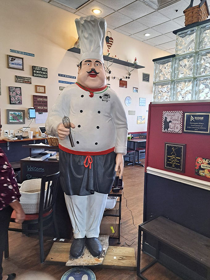 The chef statue stands guard like a sentinel of satisfaction, silently promising that yes, those pancakes will be as fluffy as clouds.