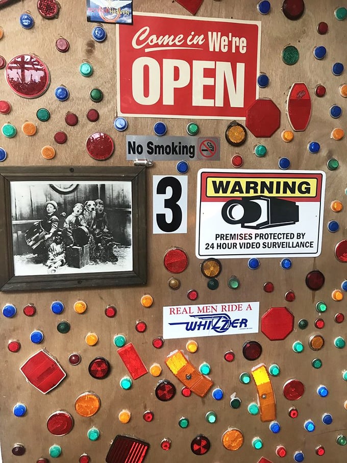 Even the doors are decorated with reflectors that catch the light. These tiny red gems once kept kids safe on twilight neighborhood rides.