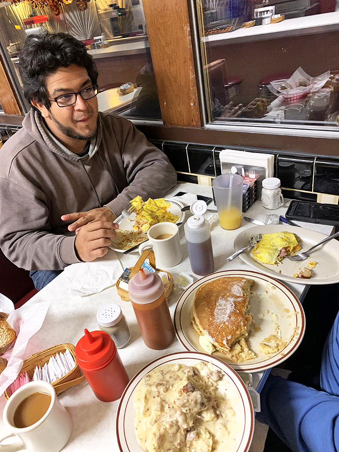 Every great diner meal comes with a side of people-watching. This patron knows the secret to happiness is a table full of breakfast classics.