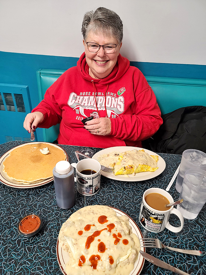 The smile says it all &ndash; massive pancakes, a hearty omelet, and biscuits with gravy creating the kind of breakfast euphoria money can't usually buy.