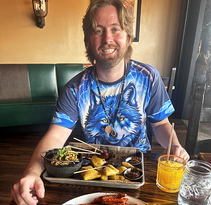 Pure joy captured in a wolf shirt &ndash; the universal expression of someone who just discovered exotic meats.