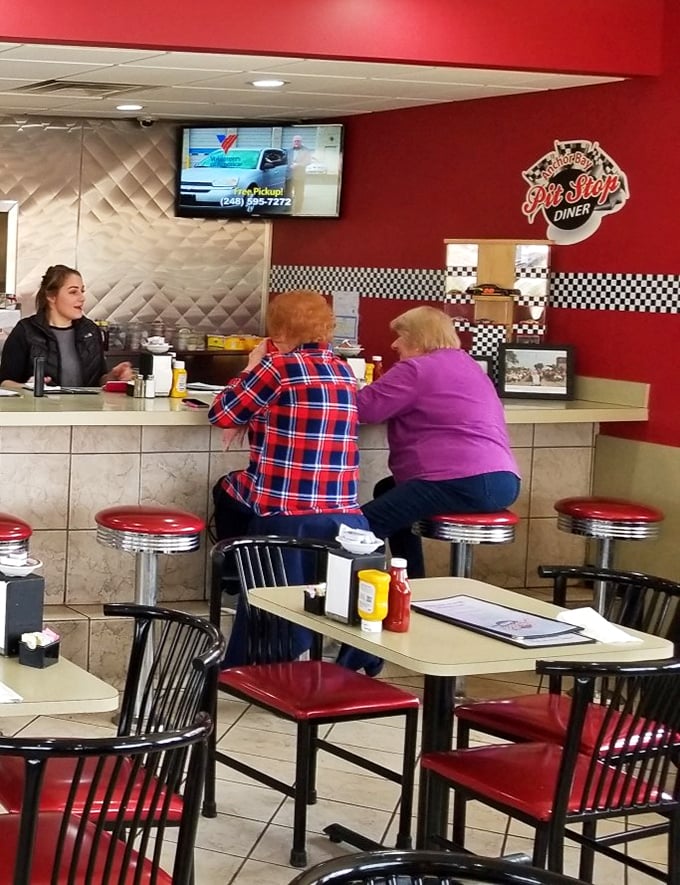 Where the counter becomes community – the heart of any great diner. Those classic red stools have heard more local stories than any therapist in town.