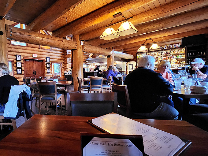 The dining room hums with the satisfied murmurs of people having the kind of meal they'll tell their friends about tomorrow. Timber-framed happiness.