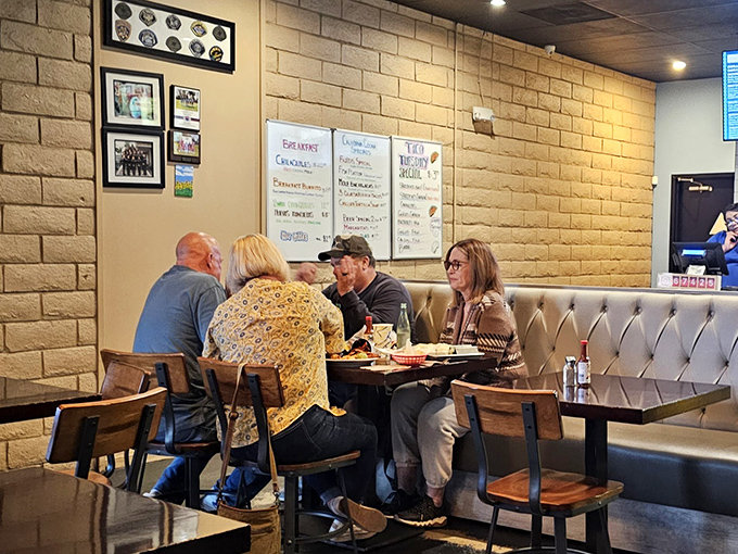 The true measure of a neighborhood gem: tables filled with locals engaged in that universal language of "pass that plate over here."