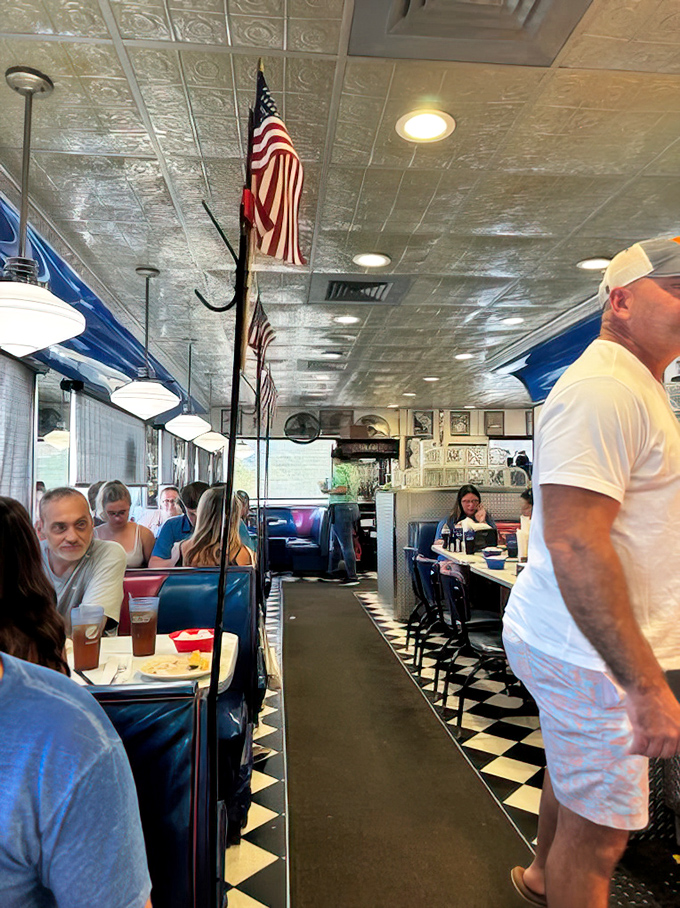 The classic diner aisle&mdash;where American flags stand proud, checkered floors gleam, and the buzz of conversation blends with the symphony of silverware on plates.