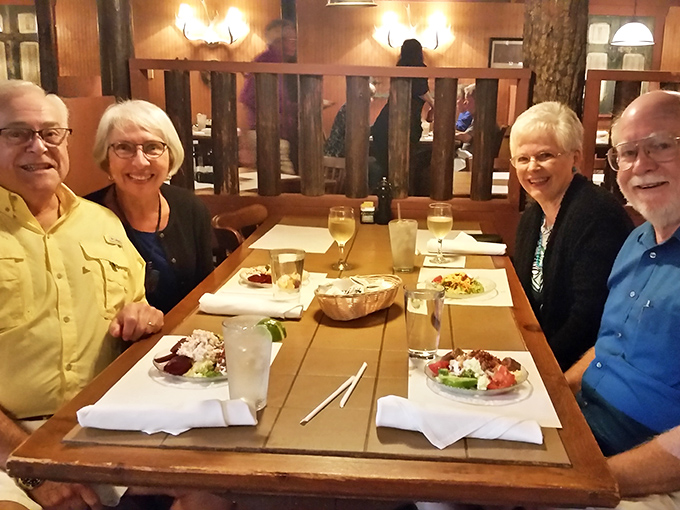 The best conversations happen around tables like these, where salads are just the opening act to an evening of culinary delight.