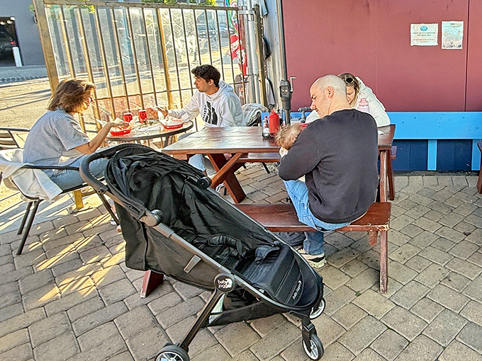 Families gathering over baskets of goodness &ndash; this is what community dining looks like in the real world.