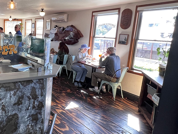 The dining room buzzes with the quiet contentment of people experiencing meat nirvana. Notice nobody's talking&mdash;they're too busy savoring.
