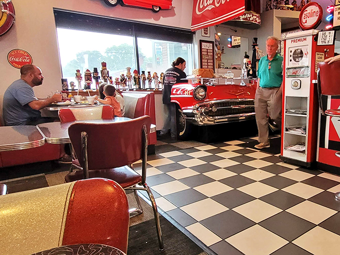 The classic diner experience includes fellow patrons who might become part of your story, all against a backdrop of vintage Americana and Coca-Cola memorabilia.