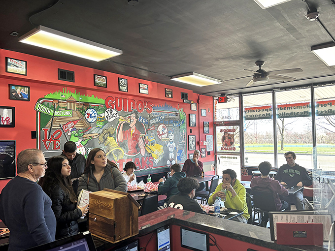 The lunch crowd knows where to find happiness &ndash; it's right here between these red walls and black tables.