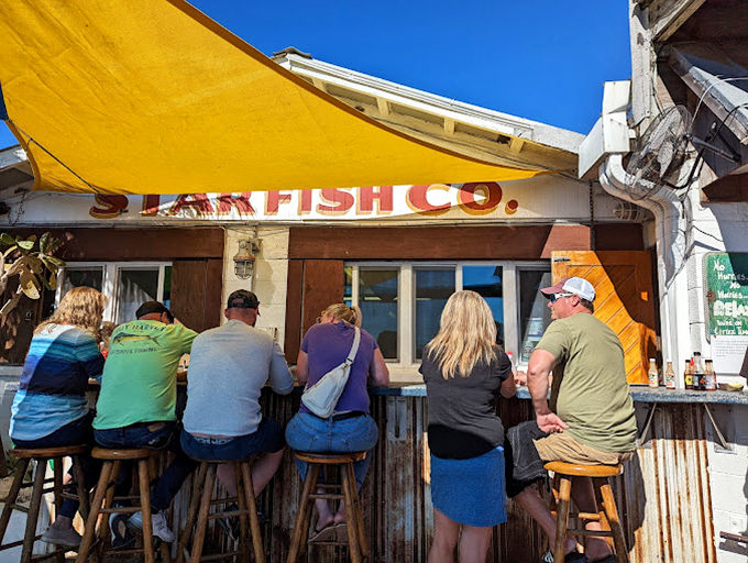 The outdoor bar where locals gather like old friends, sharing stories as fresh as the daily catch.