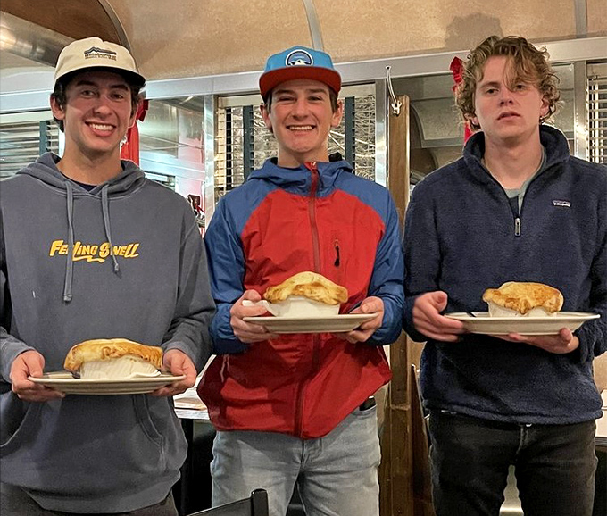 Happy diners showing off their breakfast burritos &ndash; the universal expression of "worth getting out of bed for" on full display.