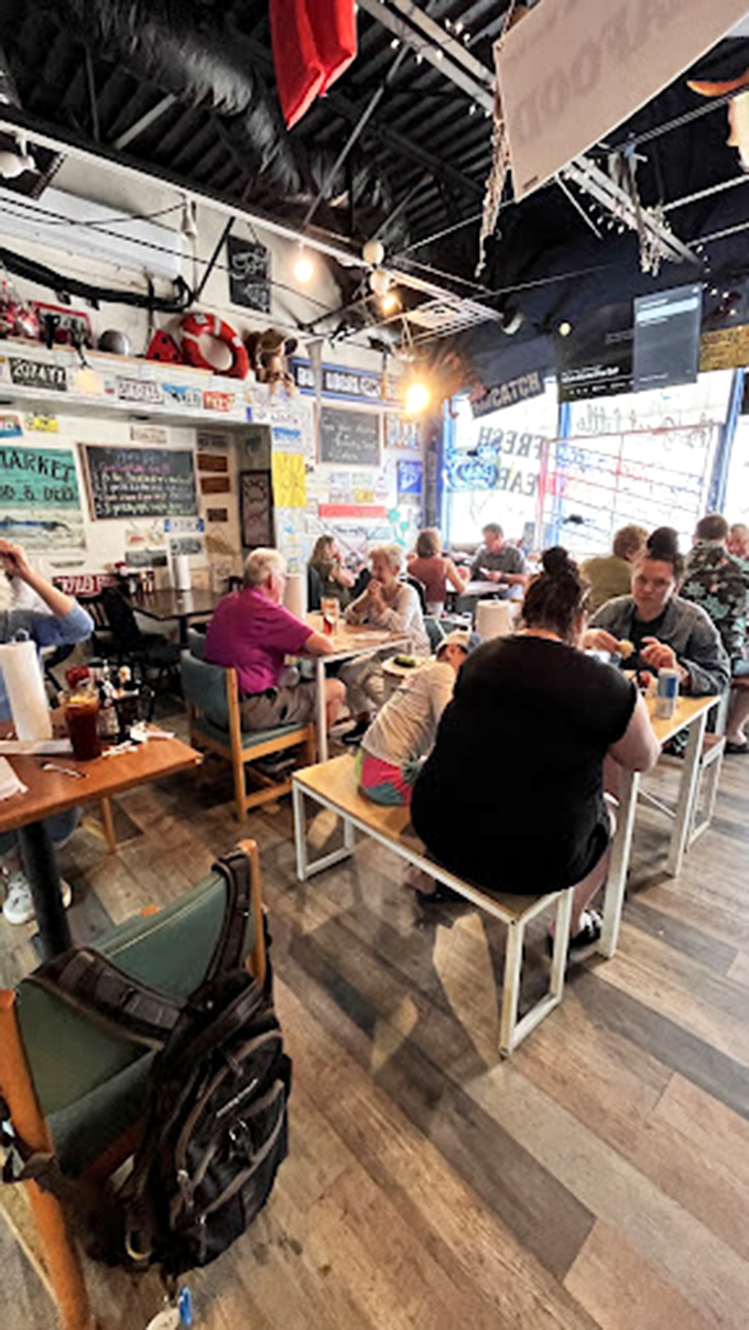 The bustling dining room where strangers become friends over shared love of seafood. Every table tells a different story with the same delicious ending.