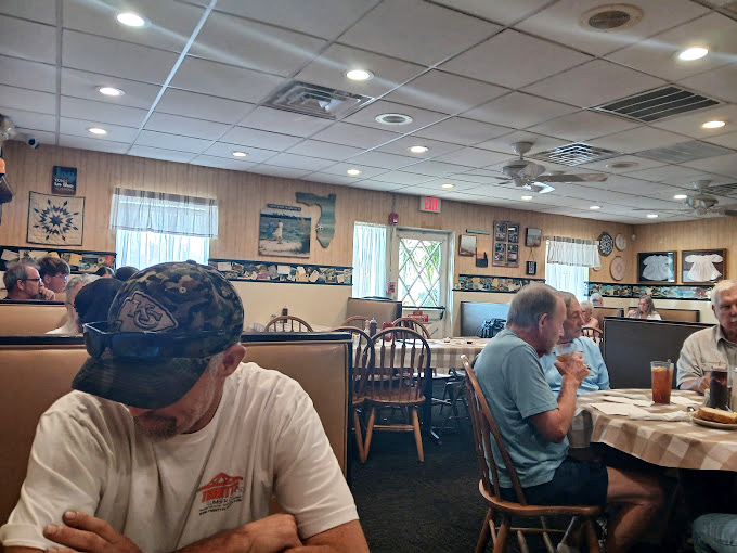 The dining room hums with the universal language of good food. Notice how nobody's looking at their phones? That's the Yoder's effect.