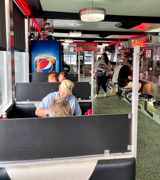 Real people enjoying real food in a real diner where conversations flow as freely as the coffee refills.