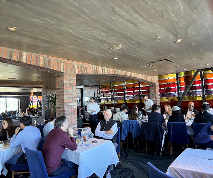 The dining room buzzes with the symphony of satisfaction&mdash;clinks of glasses, murmurs of approval, and the occasional gasp at first bites.