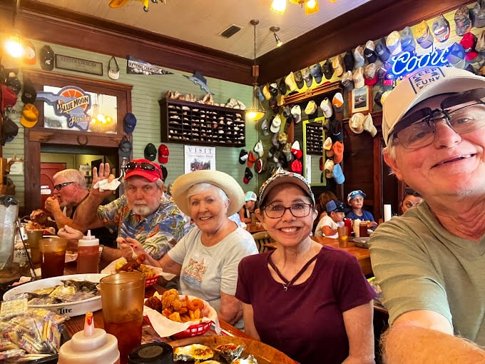 The happiest people in Florida aren't at theme parks&mdash;they're sitting at wooden tables with seafood baskets, cold drinks, and the knowledge they've found the real deal.