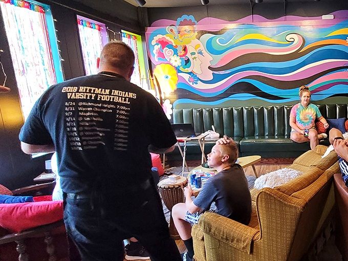 The colorful murals aren't just decoration—they're conversation starters that keep you entertained between bites of pizza perfection.