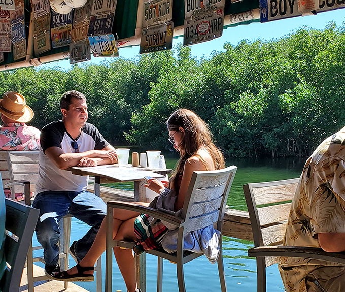 The waterfront tables offer nature's version of dinner theater: mangroves, gentle waves, and the occasional boater who's found the best lunch spot in the Keys.