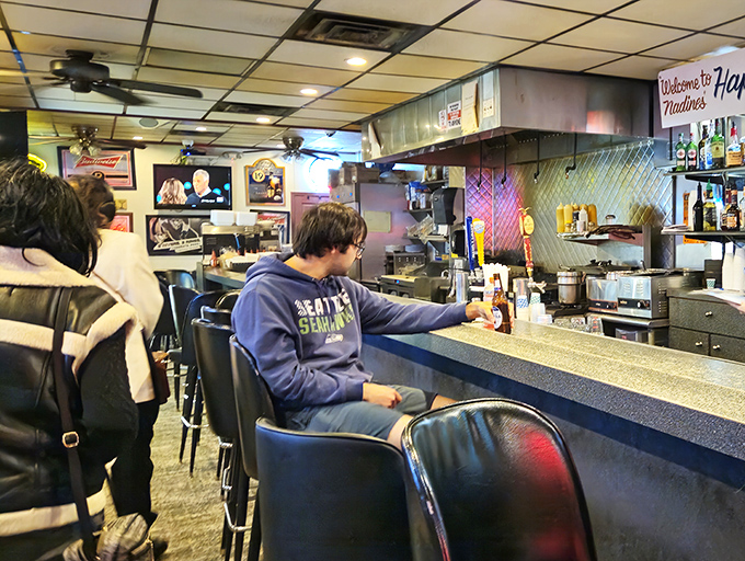 The counter at Nadine's &ndash; where strangers become regulars and regulars become family. Notice nobody's looking at their phone? That's called conversation.