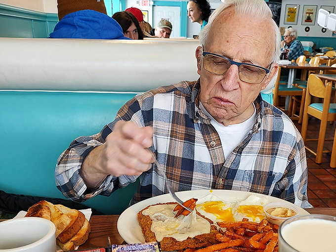 This gentleman isn't just eating breakfast&mdash;he's experiencing it. That country fried steak deserves the concentration he's giving it.